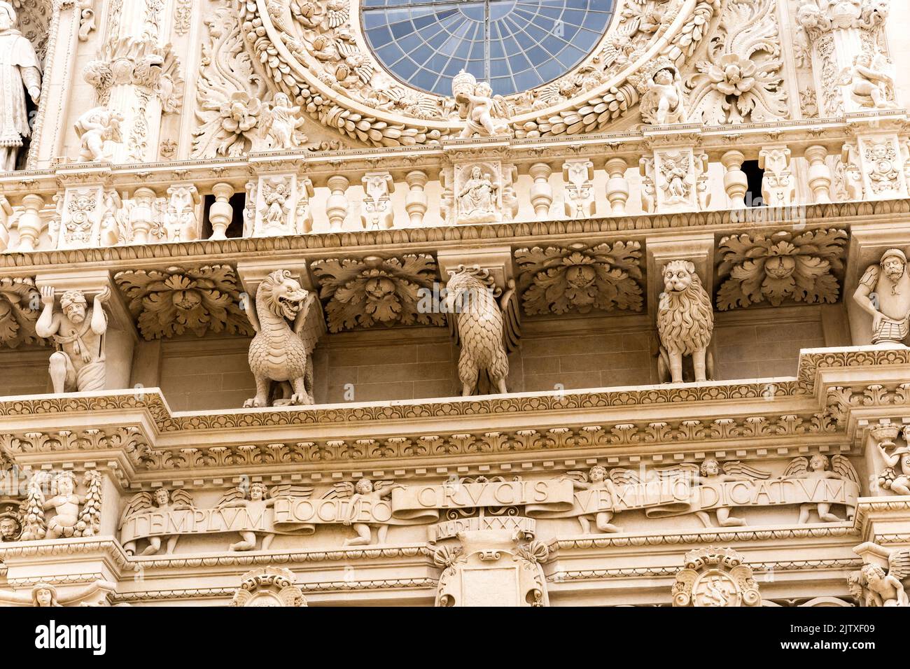 The richly decorated façade of the basilica of Santa Croce with statues ...