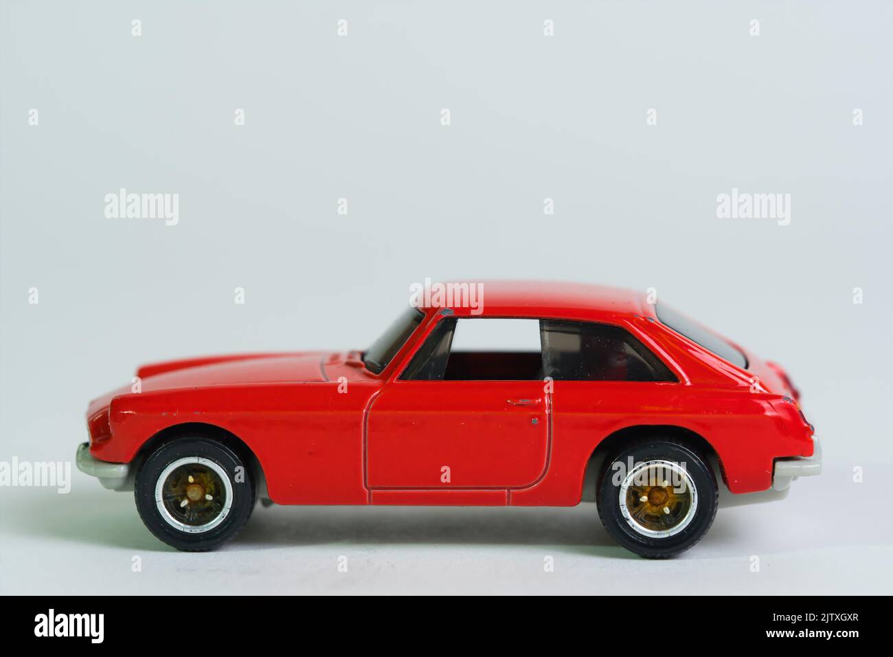 isolated red sport vintage toy car on white background, side view Stock ...