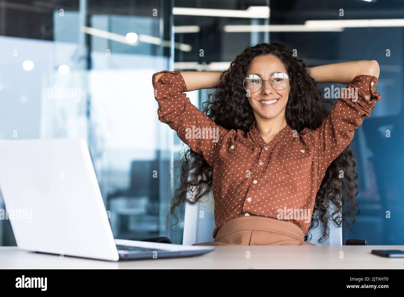 Young woman engineer developer programmer works in the office inside ...