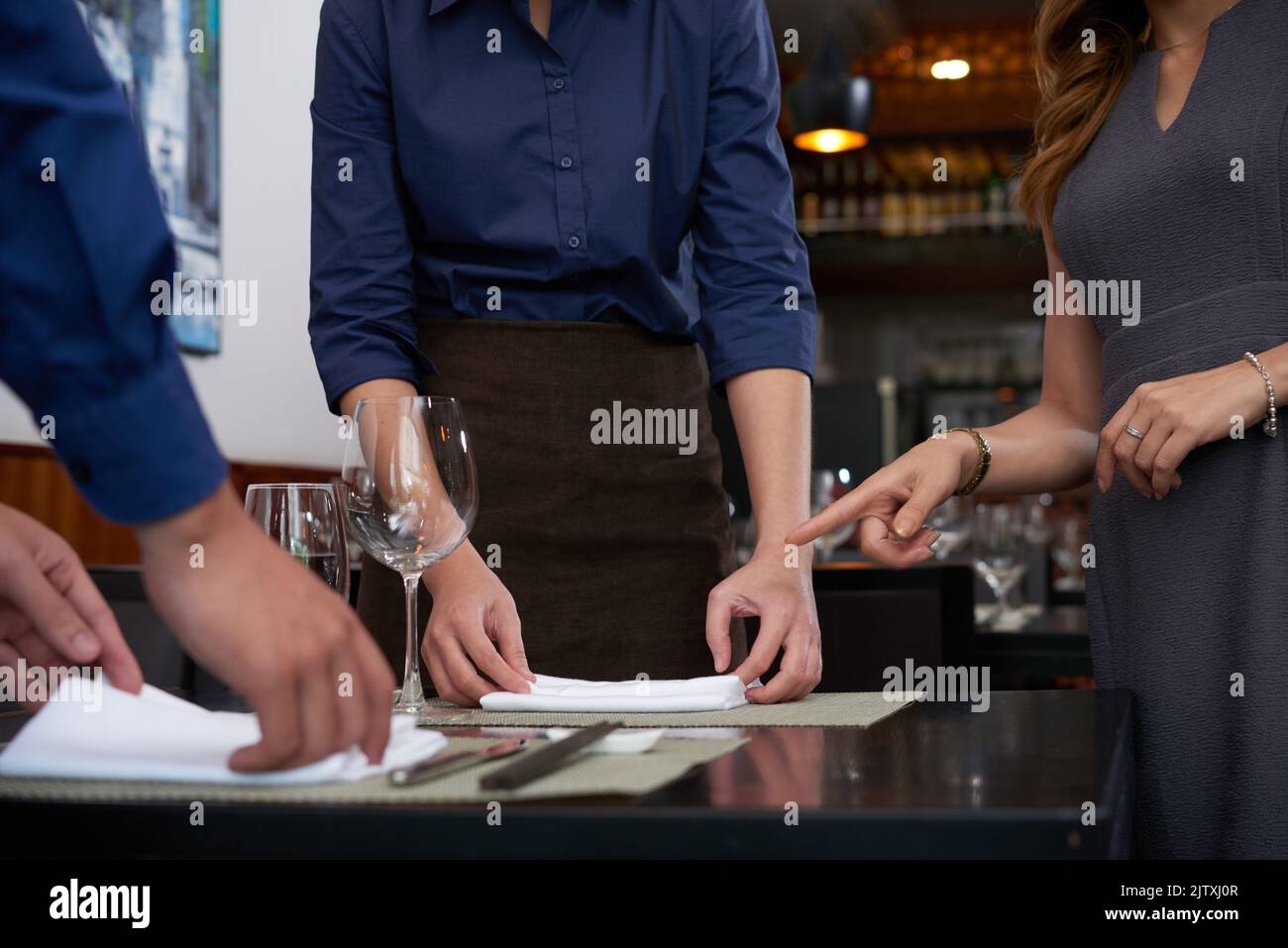 Cropped image of restaurant owner explaining work to employees Stock ...