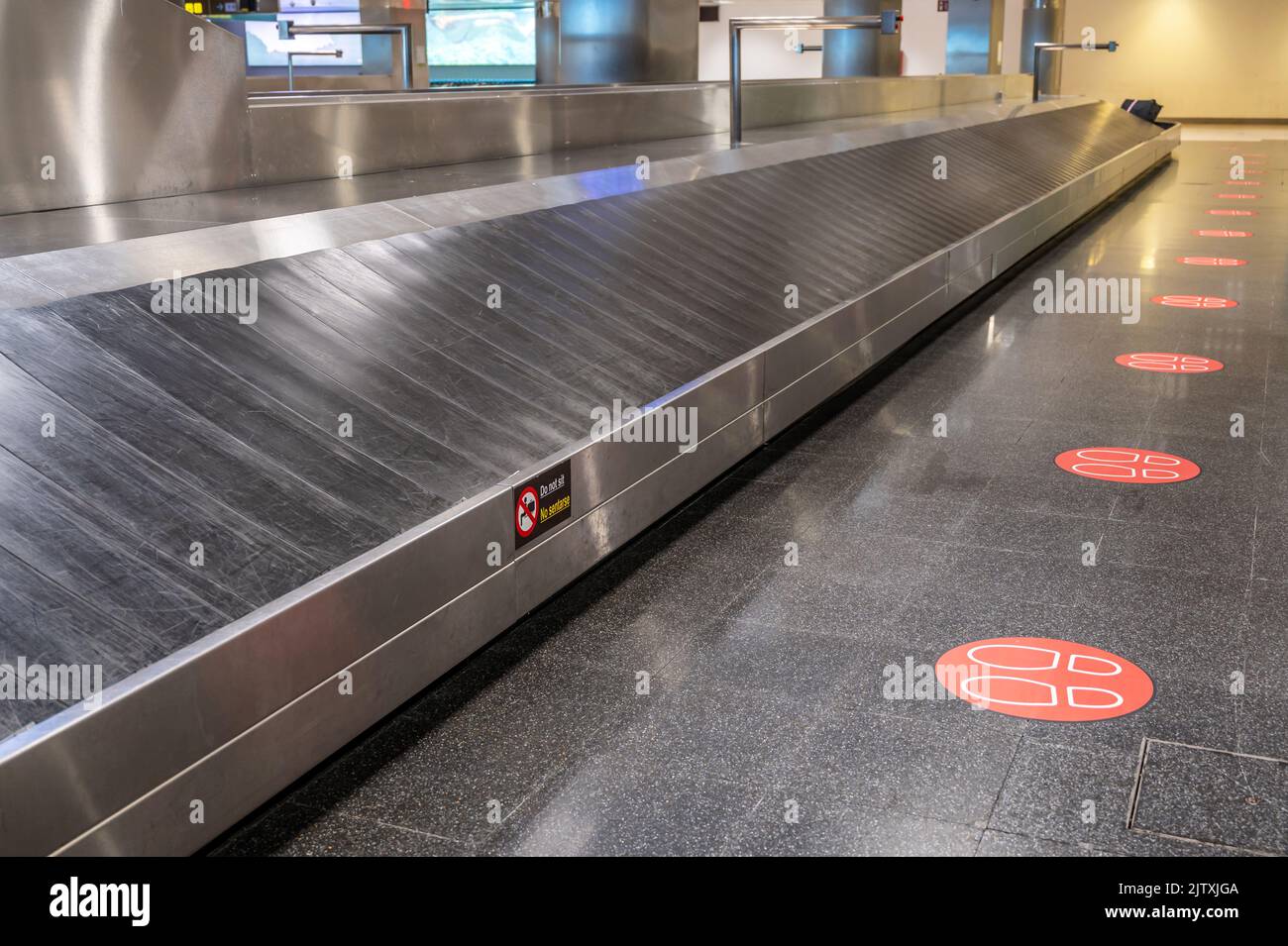 Empty baggage carousel in a terminal as a symbol of a lost suitcase ...