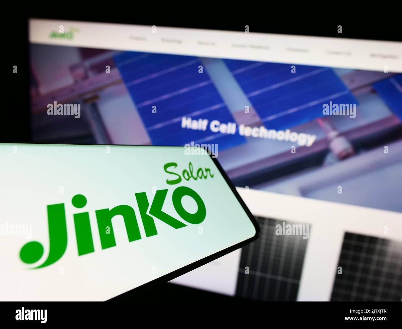 Mobile phone with logo of Chinese company JinkoSolar Holding Co. Ltd ...