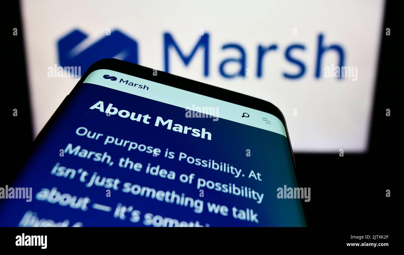 Smartphone with website of American financial company Marsh Inc. on ...