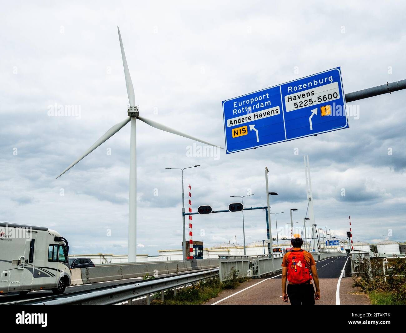 Brielle, Netherlands. 27th Aug, 2022. A man is seen walking on a bike ...