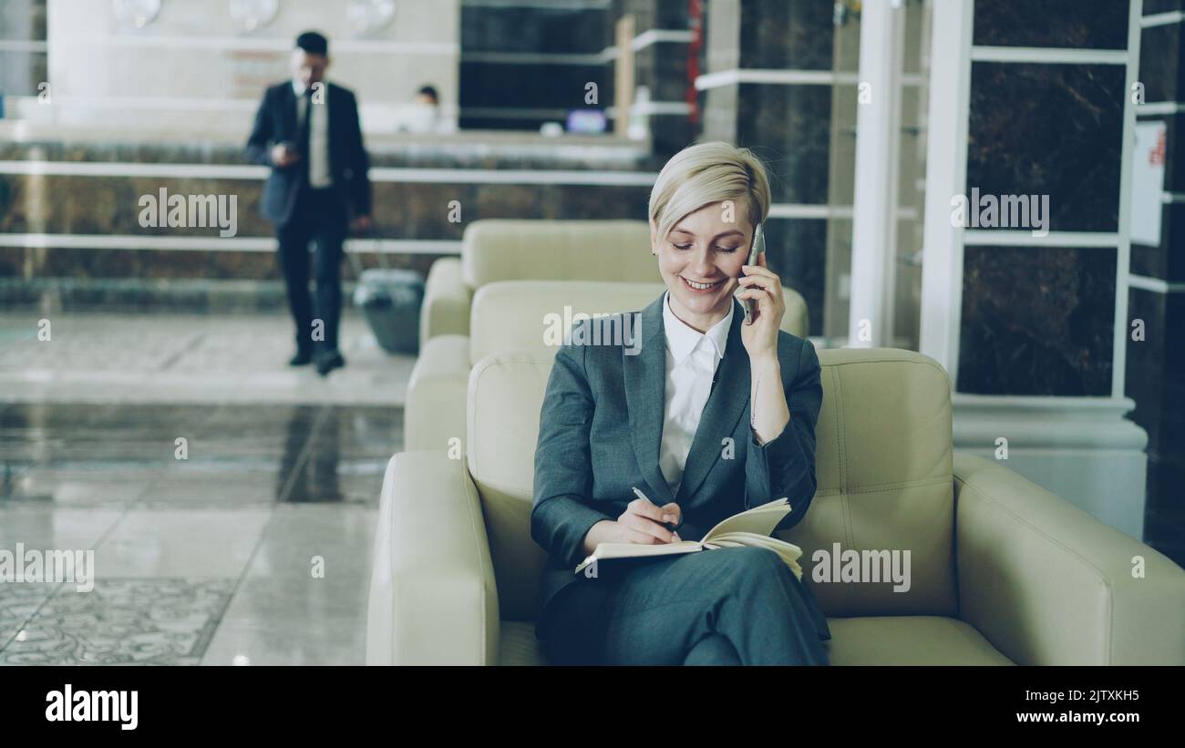 Woman walking office reception lobby hi-res stock photography and ...