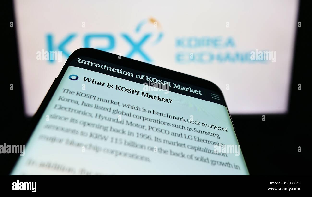 Mobile phone with webpage of financial marketplace Korea Exchange (KRX ...