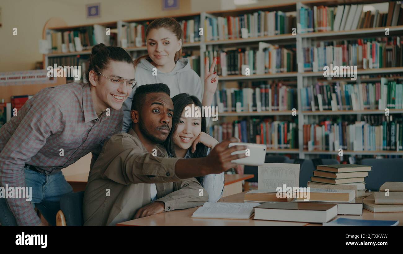 Group of international students have fun smiling and making selfie ...