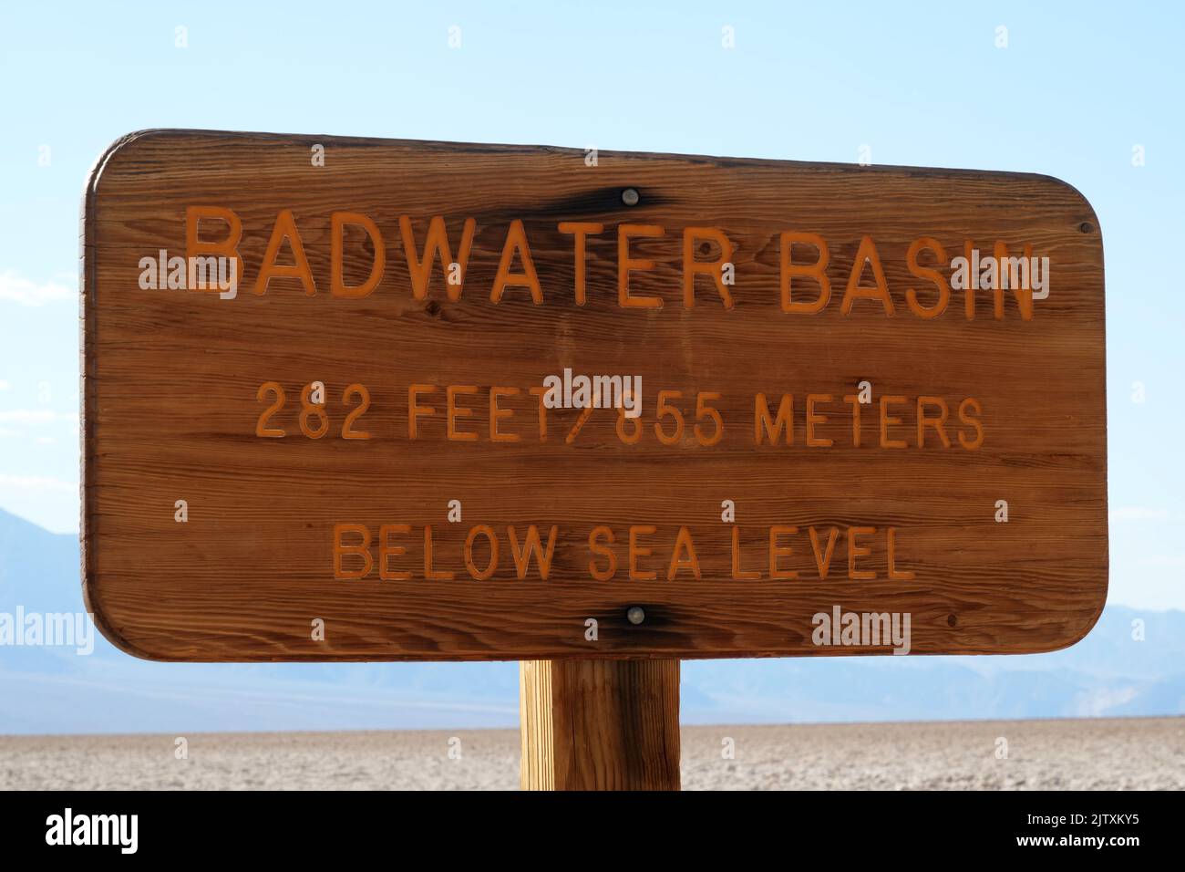 A 282 feet and 855m below Sea Level elevation sign at Badwater Basin ...