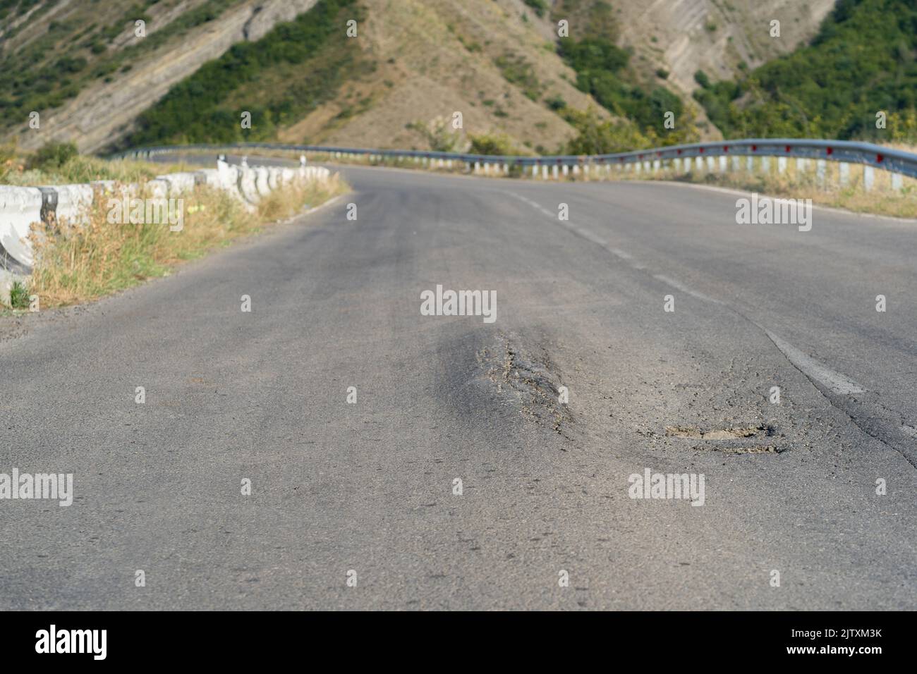 Deformed asphalt surface of road caused by melting of material due to ...
