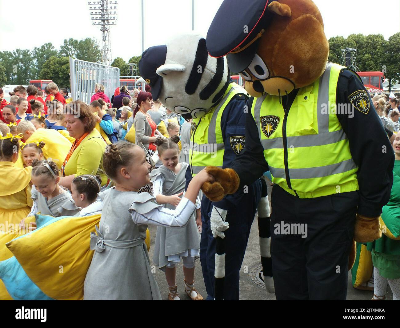 Latvia, Riga. Police officers in costumes from children's cartoons get ...