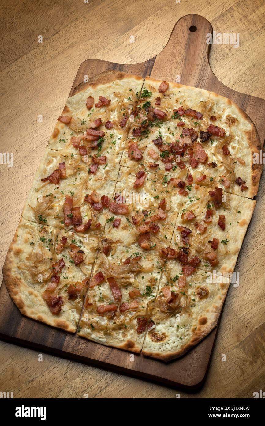 Flammkuchen tarte flambee rectangular pizza with bacon and chicken on ...