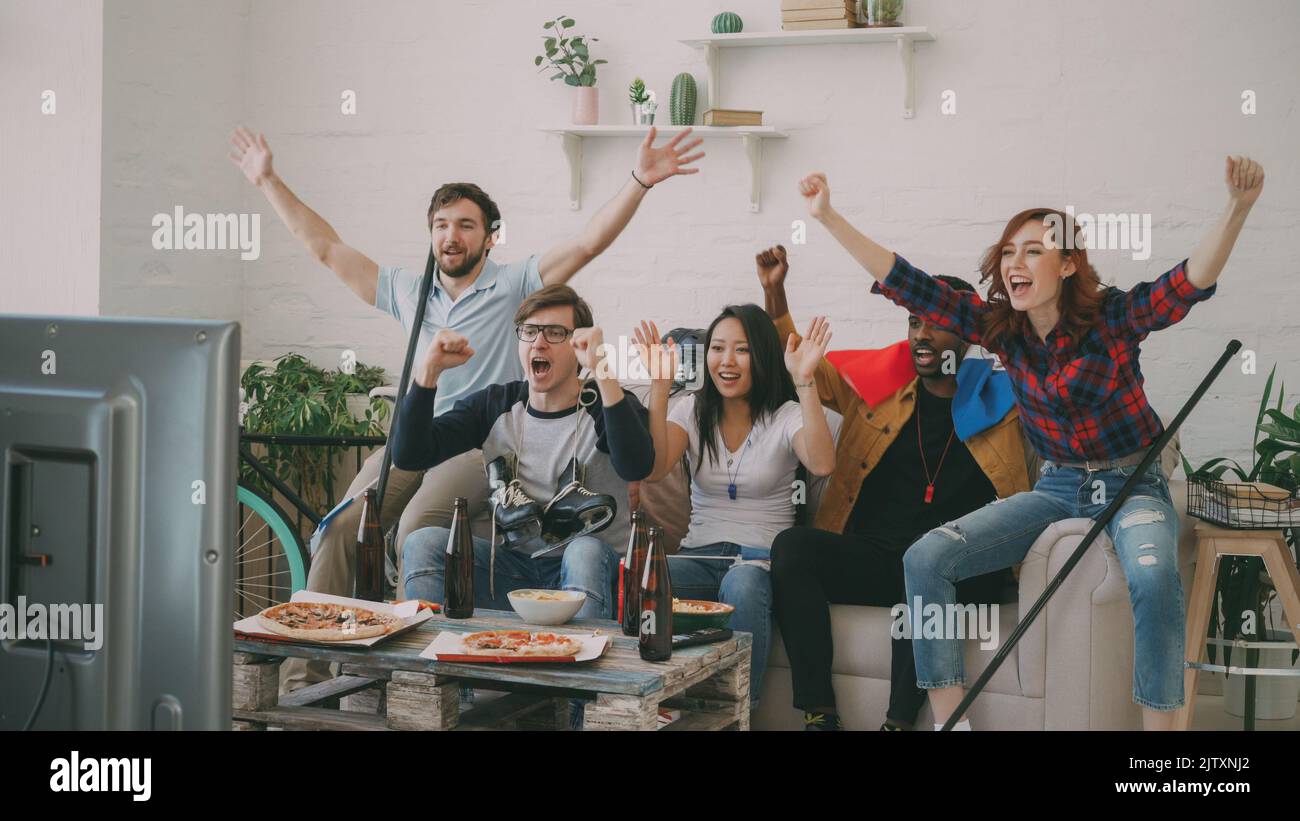 Multi ethnic group of friends sports fans with French national flags ...