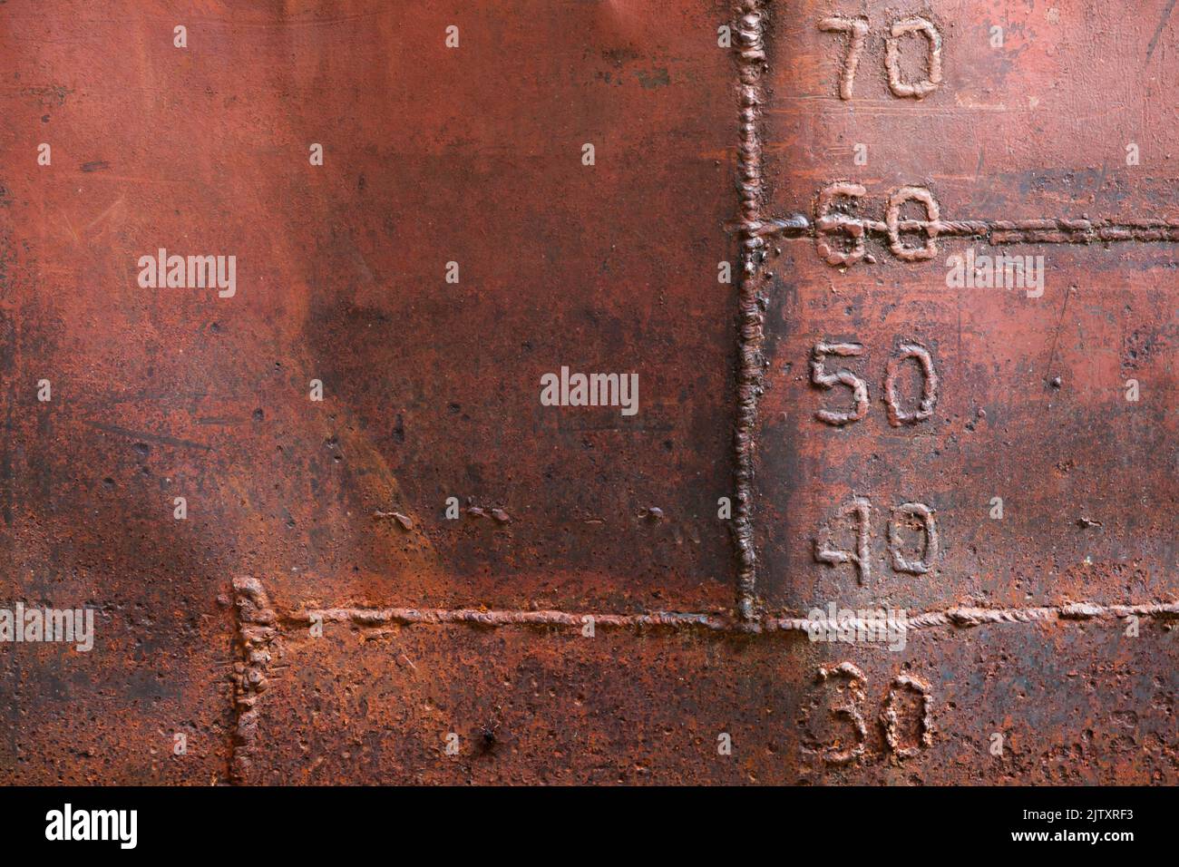 Grungy old ship hull with weld seams and draft marks, front view ...