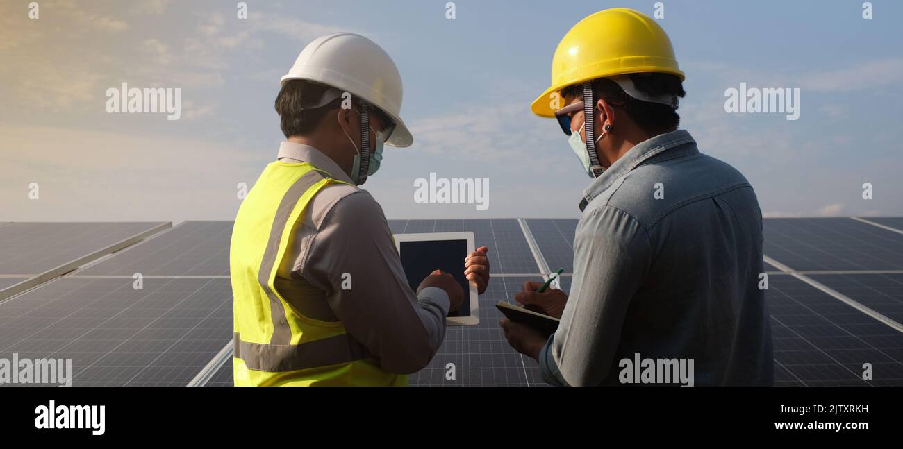 Engineer working with workers working as a team against the backdrop of ...