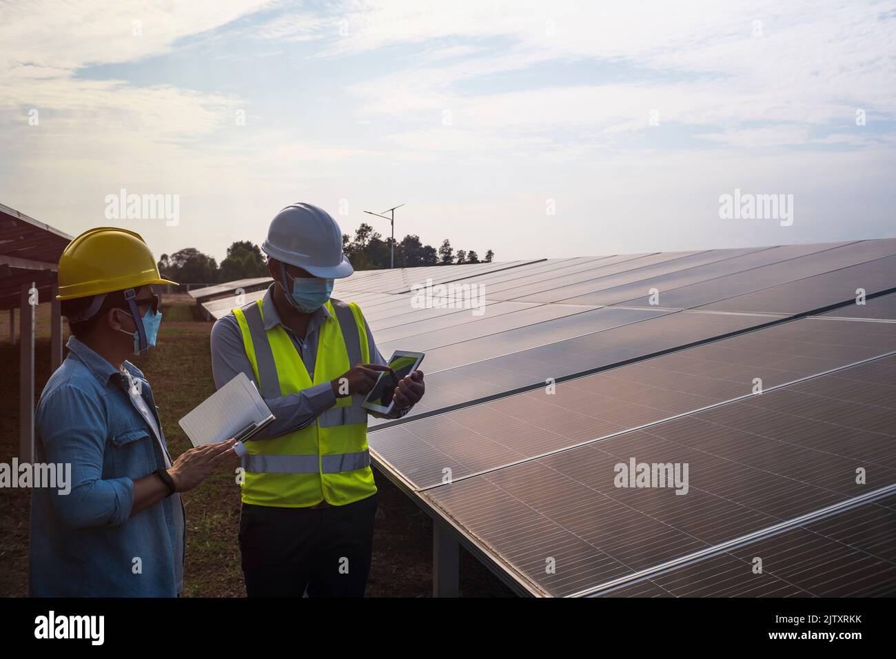 Engineer working with workers working as a team against the backdrop of ...