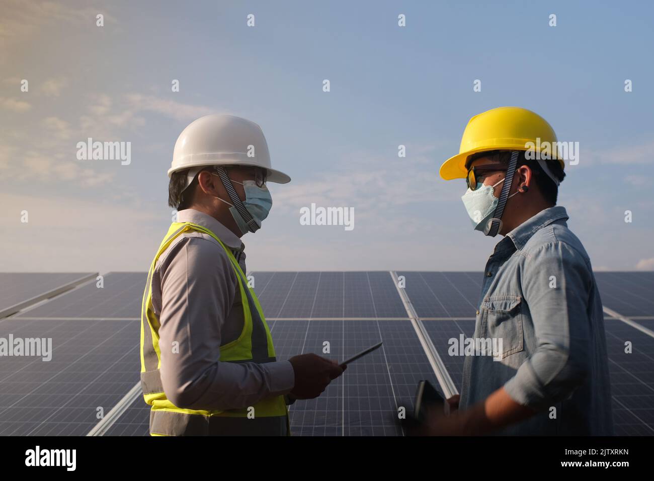 Engineer working with workers working as a team against the backdrop of ...