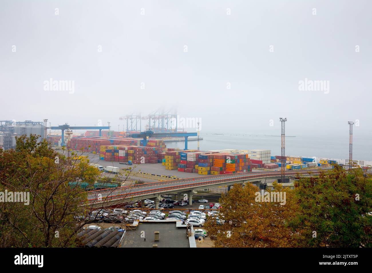 Odesa, Ukraine - OCT 22 2019: Autumn fog in the sea cargo port. Gantry ...