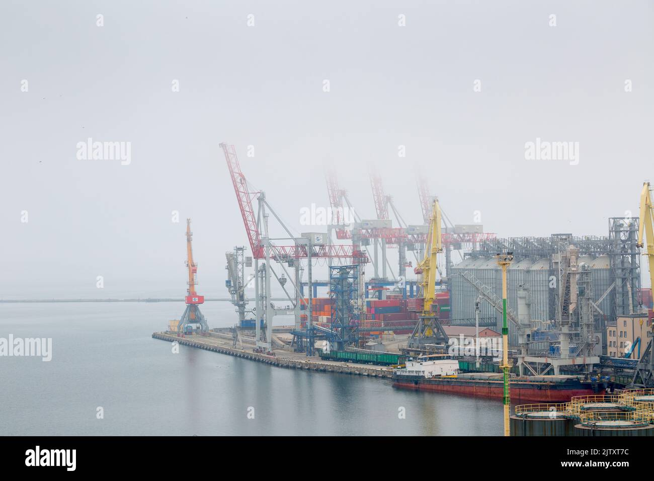 Odesa, Ukraine - OCT 22 2019: Autumn fog in the sea cargo port. Gantry ...