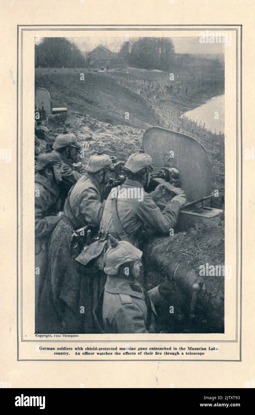 German soldiers with shield-protected machine guns entrenched in the ...