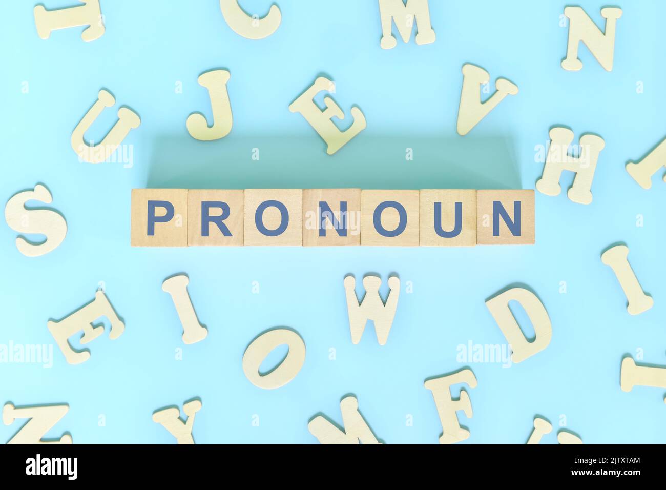 Pronoun concept in English grammar and learning class lesson. Wooden ...