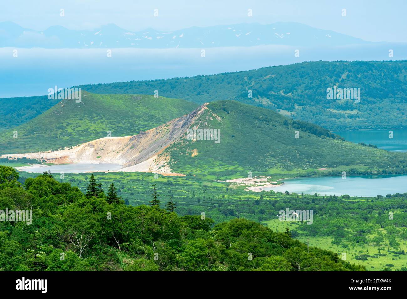 landscape of Kunashir Island, geothermal lakes among lava domes in the ...