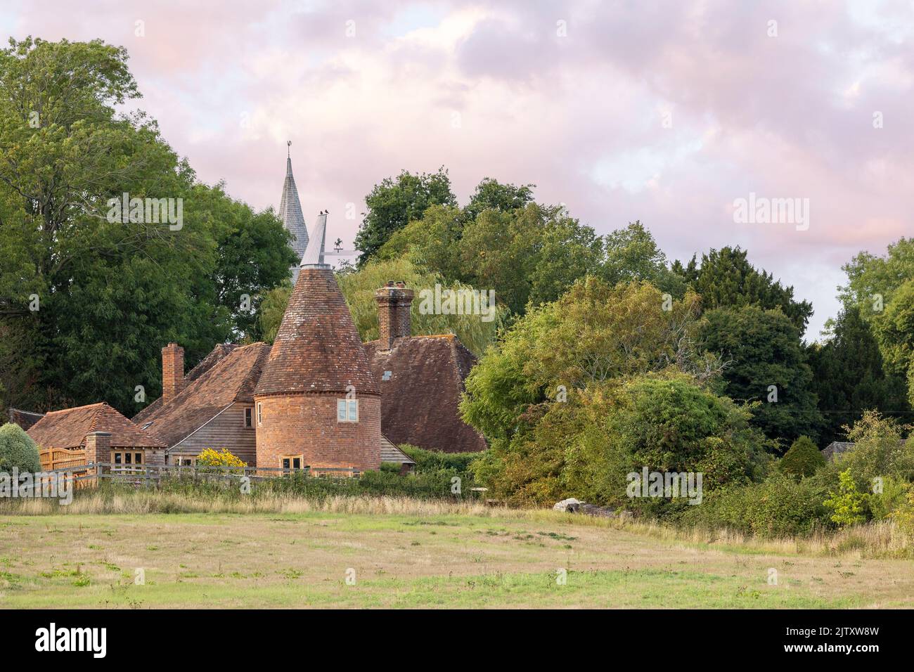 English hop house in the Kentish landscape during a colourful evening ...