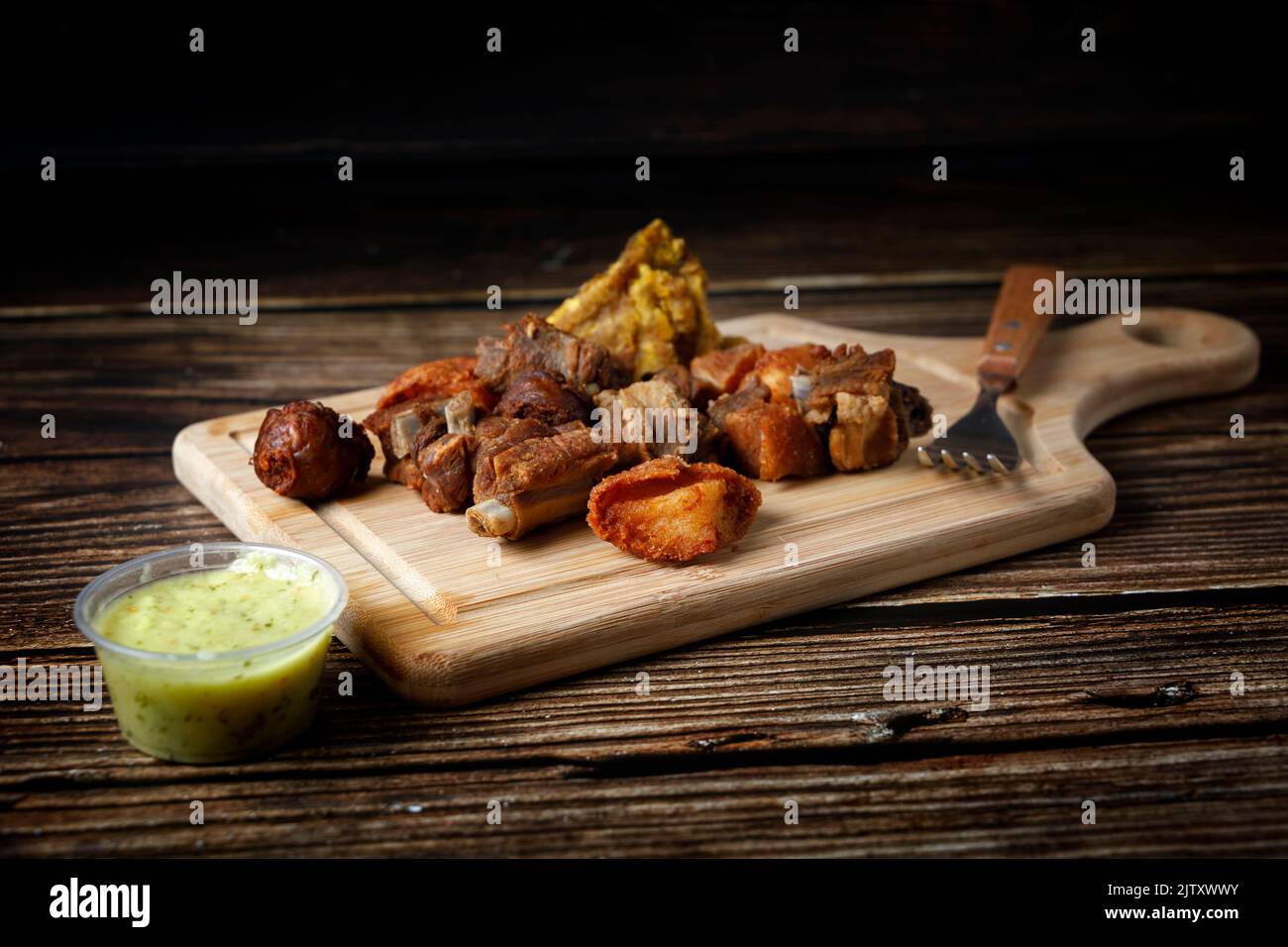 Traditional Colombian food with fried meat and banana Stock Photo - Alamy