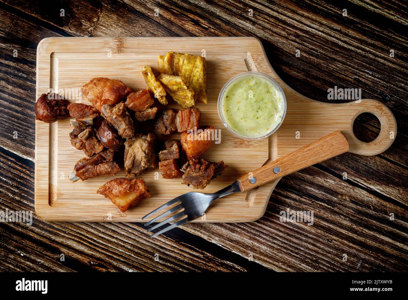 Traditional Colombian food with fried meat and banana Stock Photo - Alamy