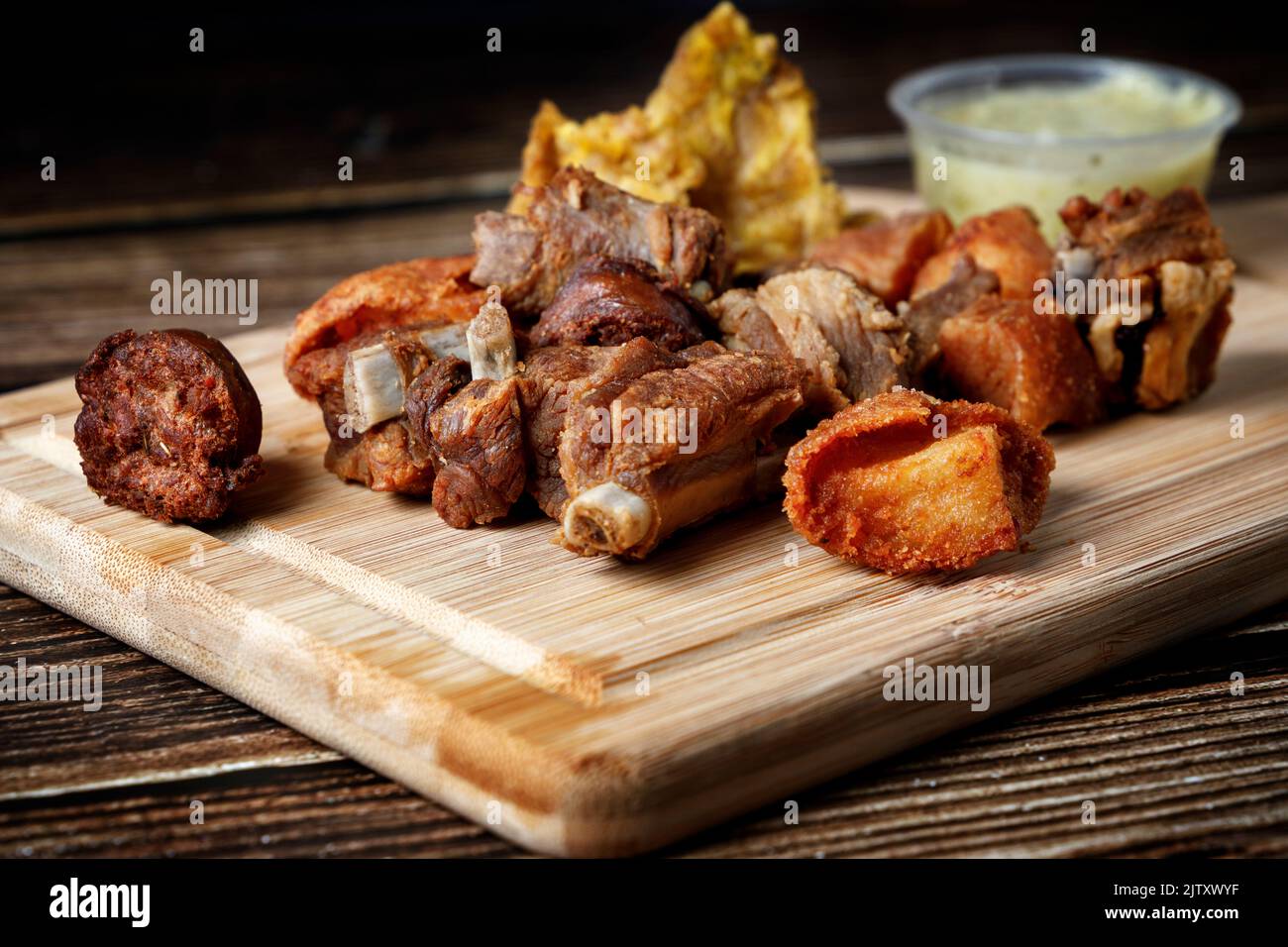 Traditional Colombian food with fried meat and banana Stock Photo - Alamy