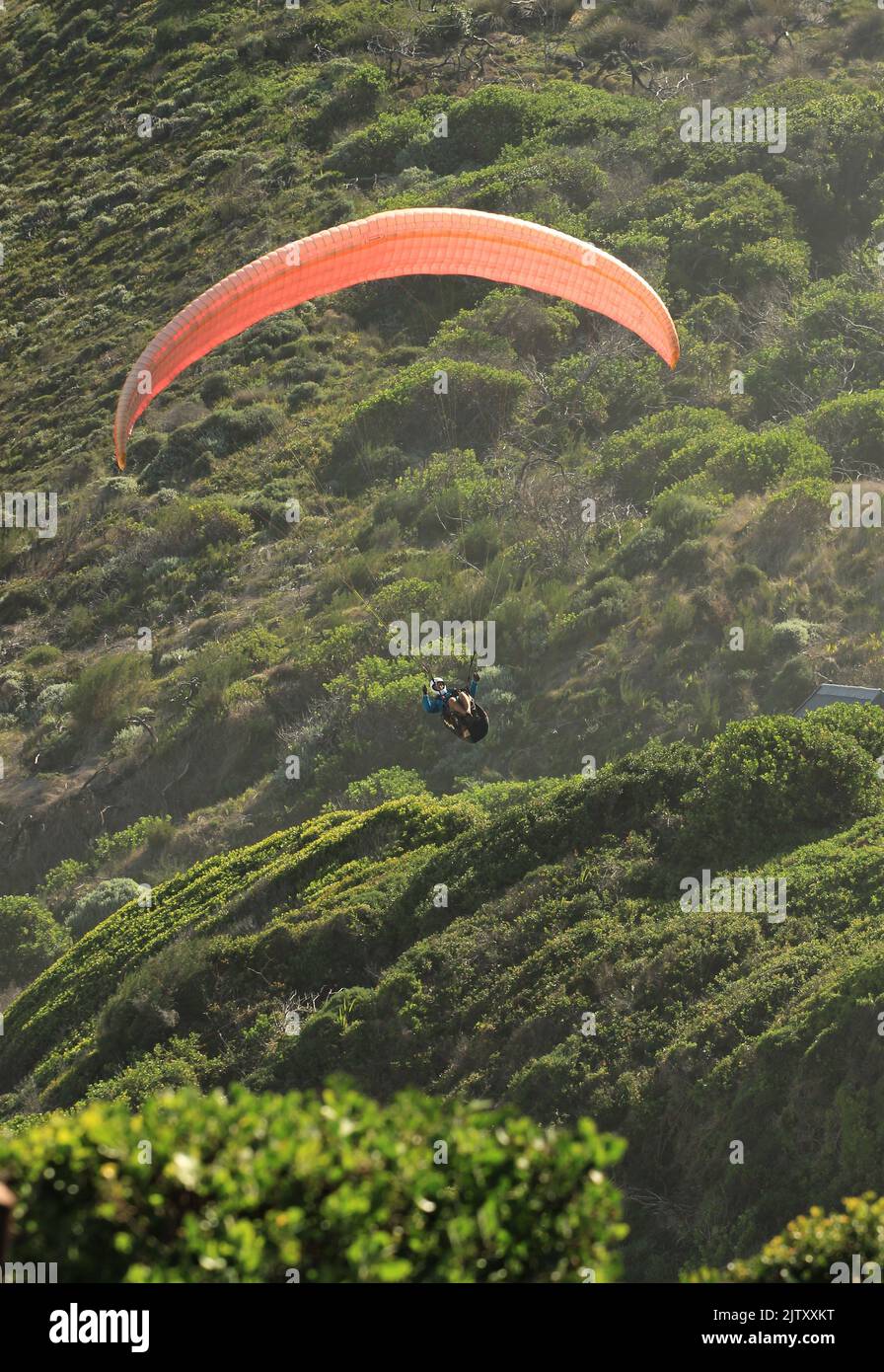 Paraglider flying in the air Stock Photo - Alamy