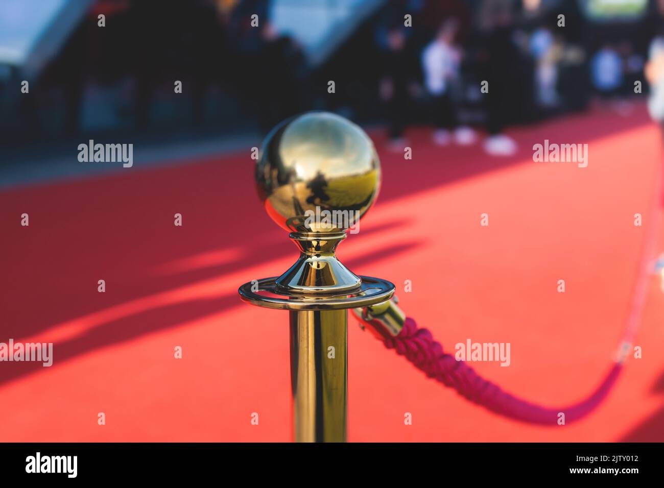 Red carpet with the ropes and golden barriers on a luxury party ...