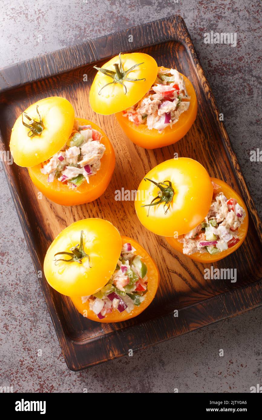 Traditional portuguese snack tomatoes stuffed with canned tuna and ...