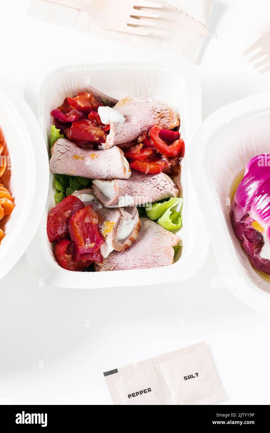 Collection of white plastic take away boxes with healthy food. Set of ...