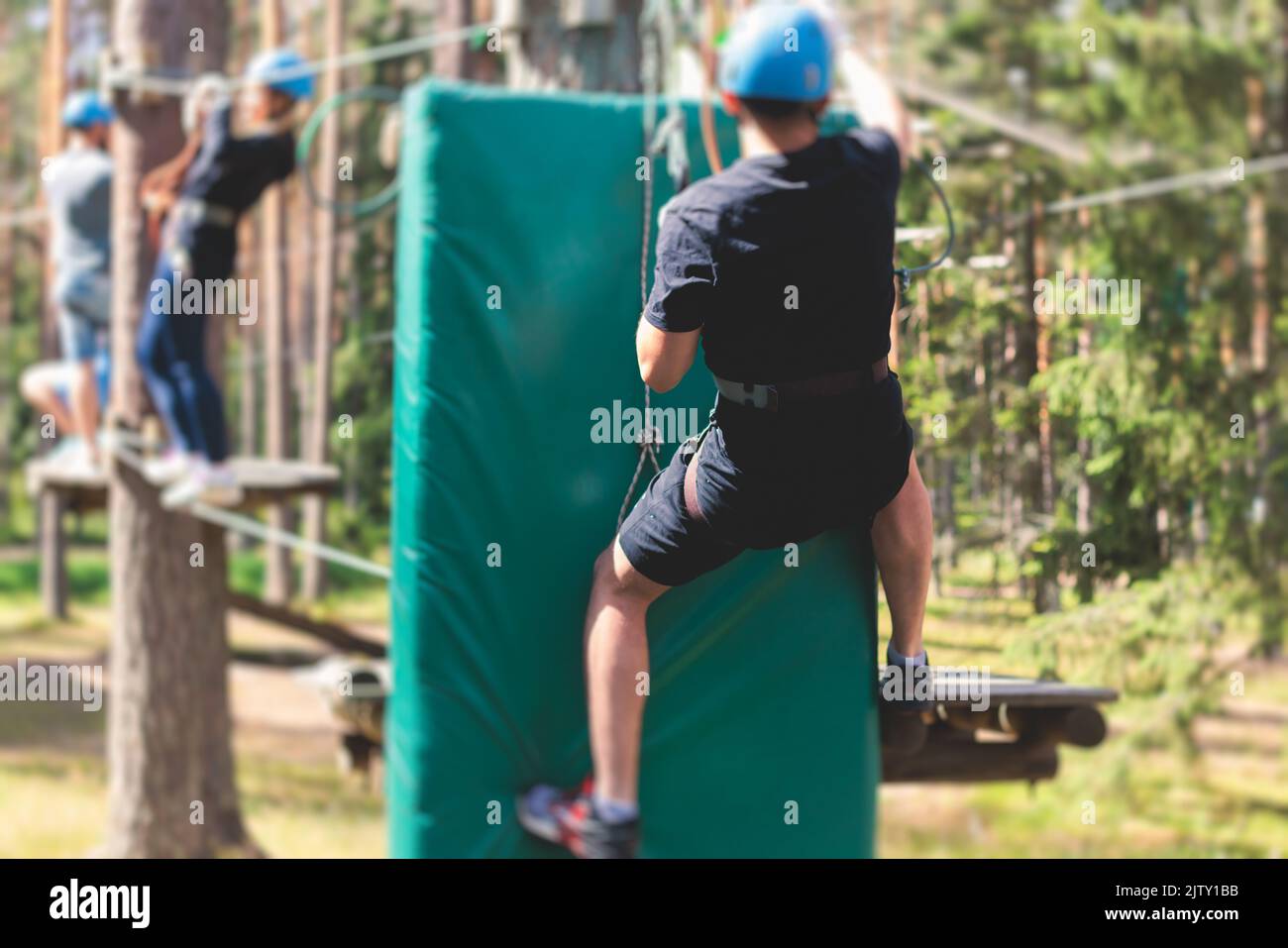 View of high ropes course, process of climbing in amusement acitivity ...