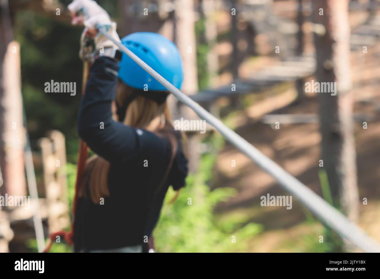 View of high ropes course, process of climbing in amusement acitivity ...