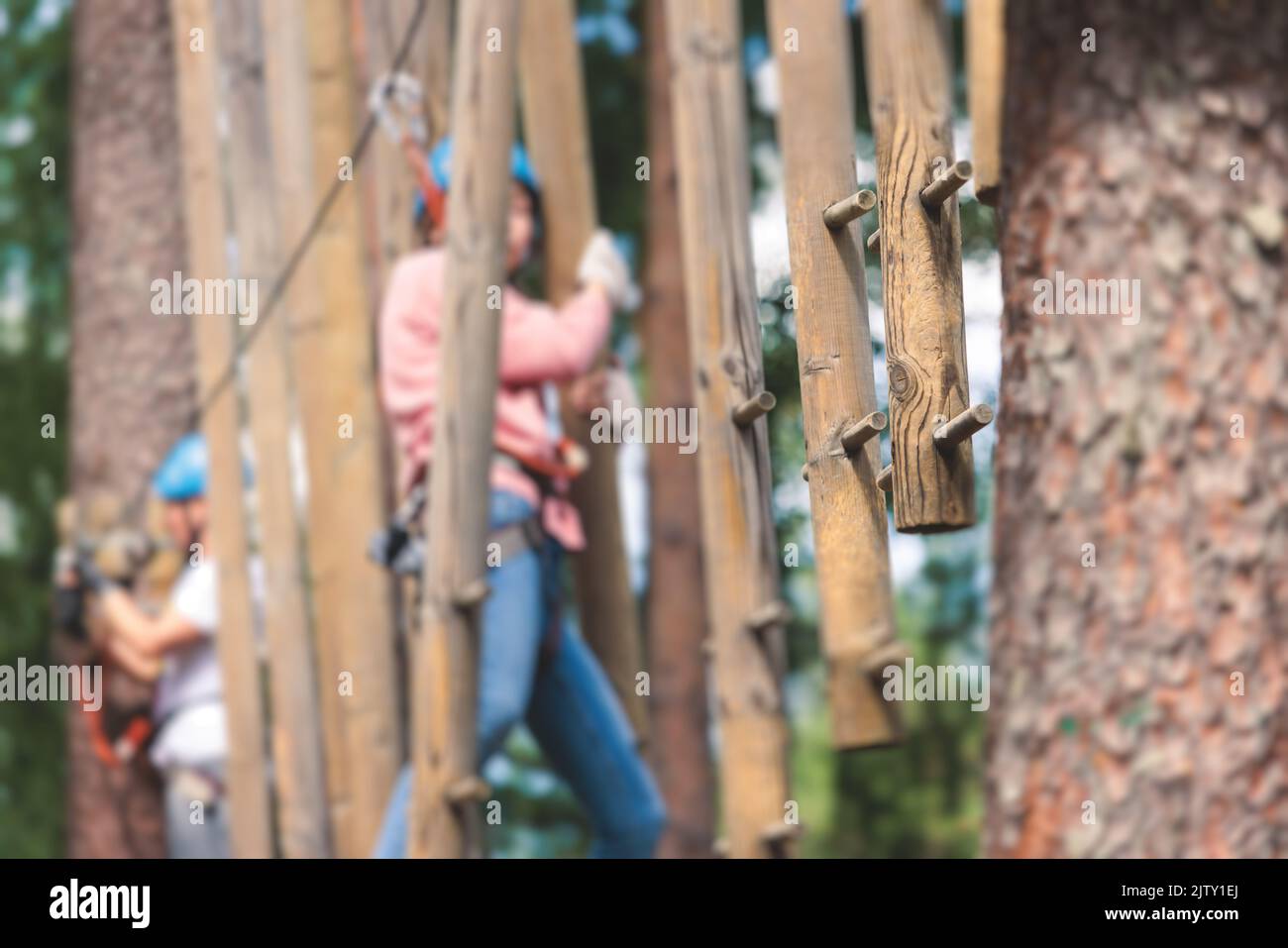 View of high ropes course, process of climbing in amusement acitivity ...