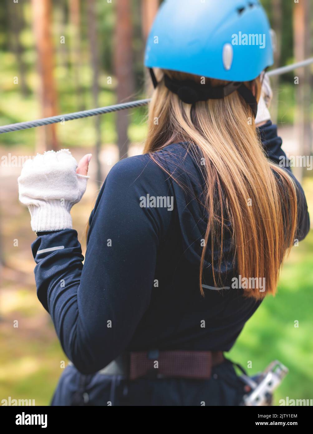 View of high ropes course, process of climbing in amusement acitivity ...