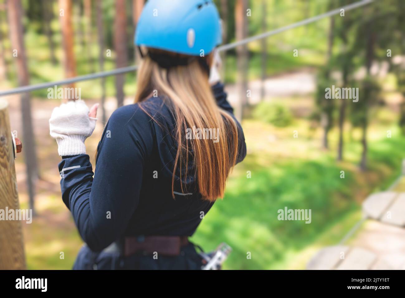 View of high ropes course, process of climbing in amusement acitivity ...