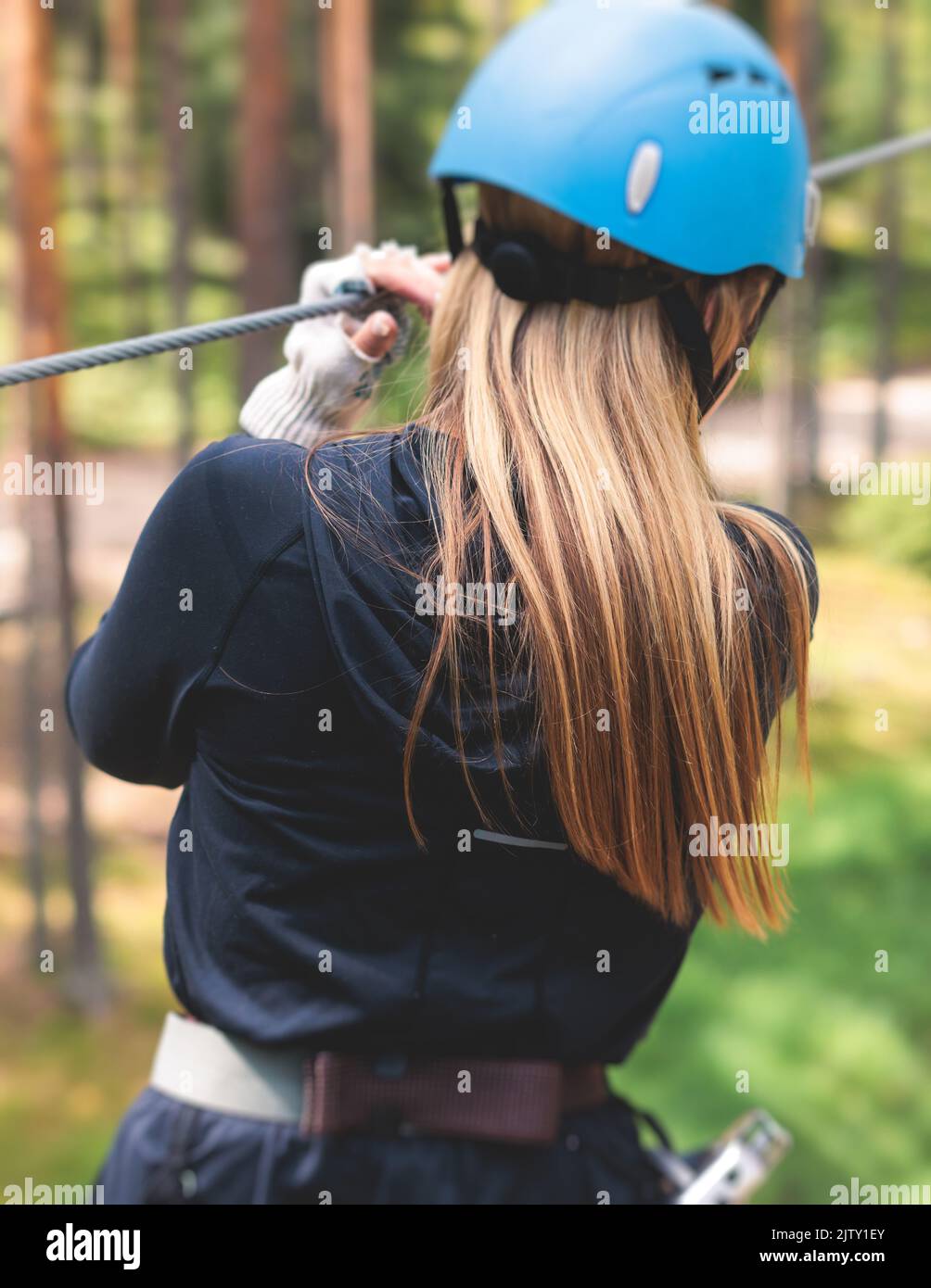 View of high ropes course, process of climbing in amusement acitivity ...