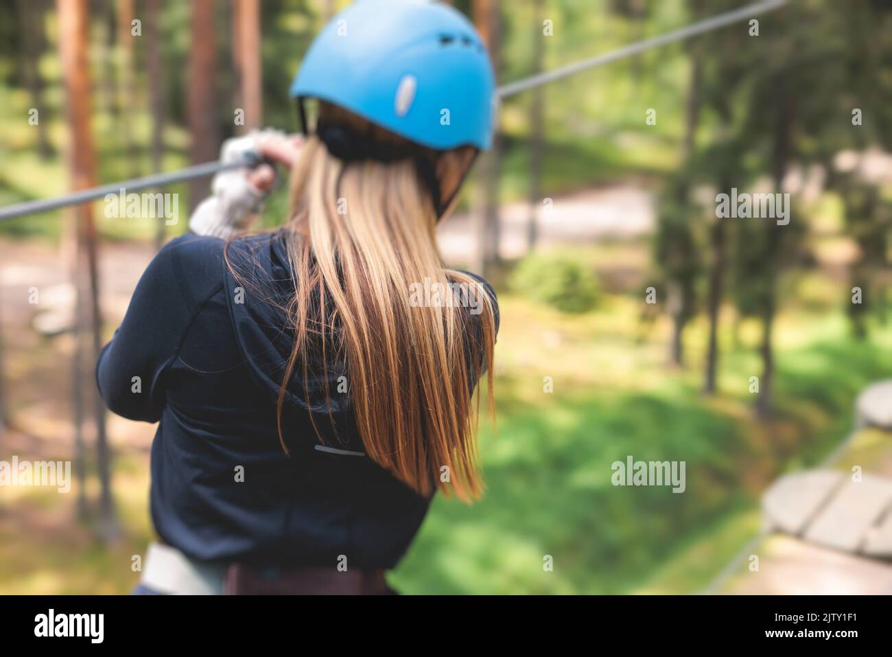 View of high ropes course, process of climbing in amusement acitivity ...