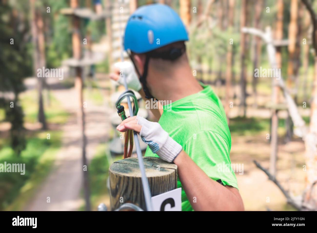 View of high ropes course, process of climbing in amusement acitivity ...