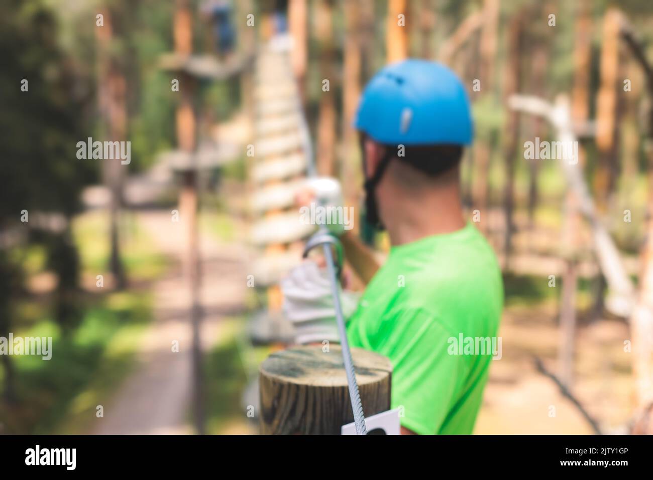View of high ropes course, process of climbing in amusement acitivity ...