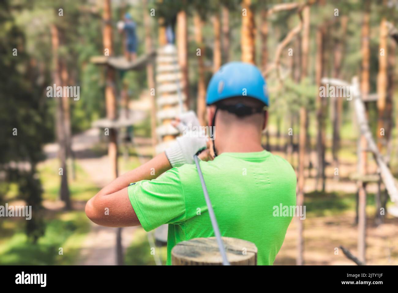View of high ropes course, process of climbing in amusement acitivity ...