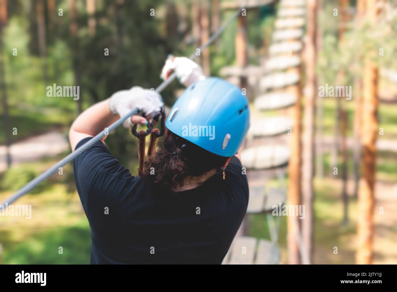 View of high ropes course, process of climbing in amusement acitivity ...