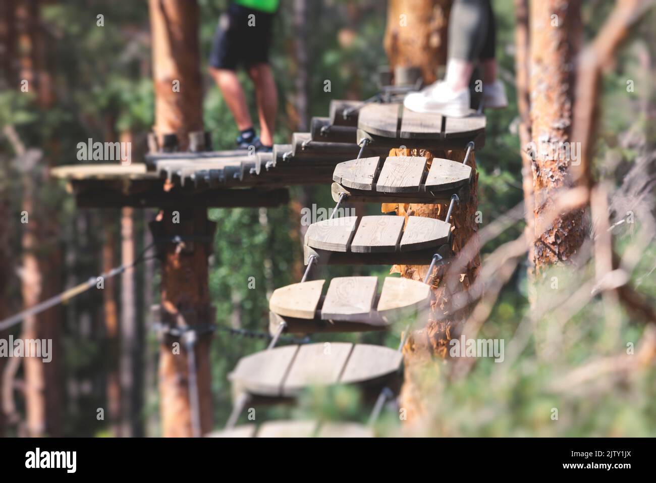 View of high ropes course, process of climbing in amusement acitivity ...