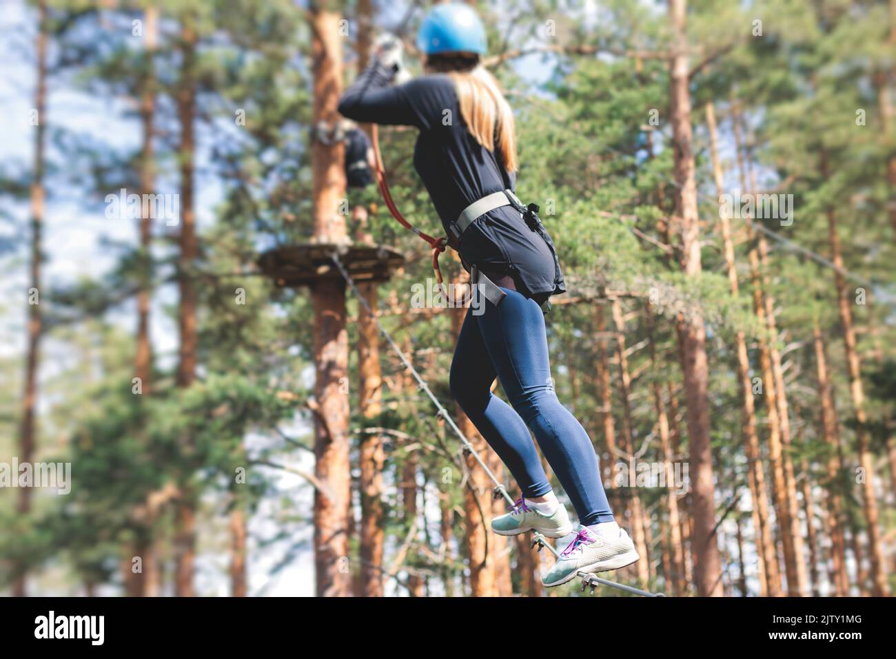 View of high ropes course, process of climbing in amusement acitivity ...