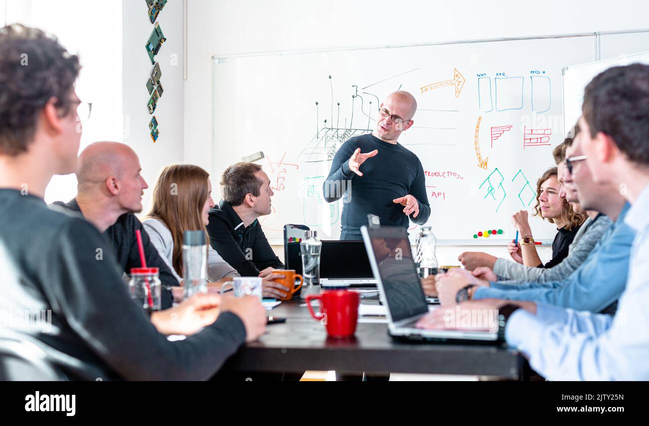 Relaxed informal IT business startup company team meeting Stock Photo ...
