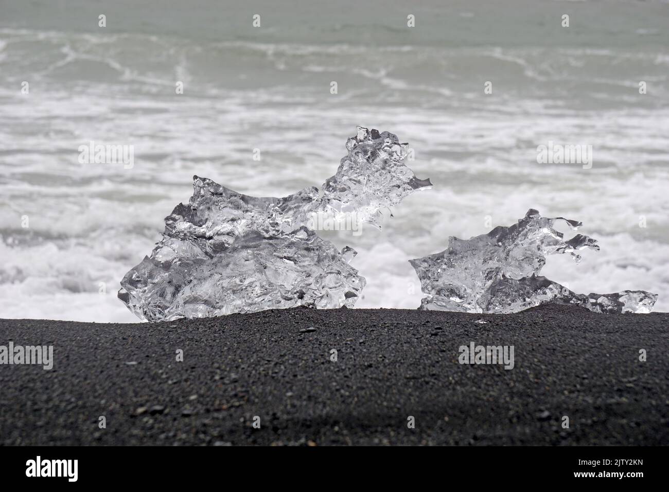 Block of ice on a black, volcanic shore - Diamond Beach in Iceland ...