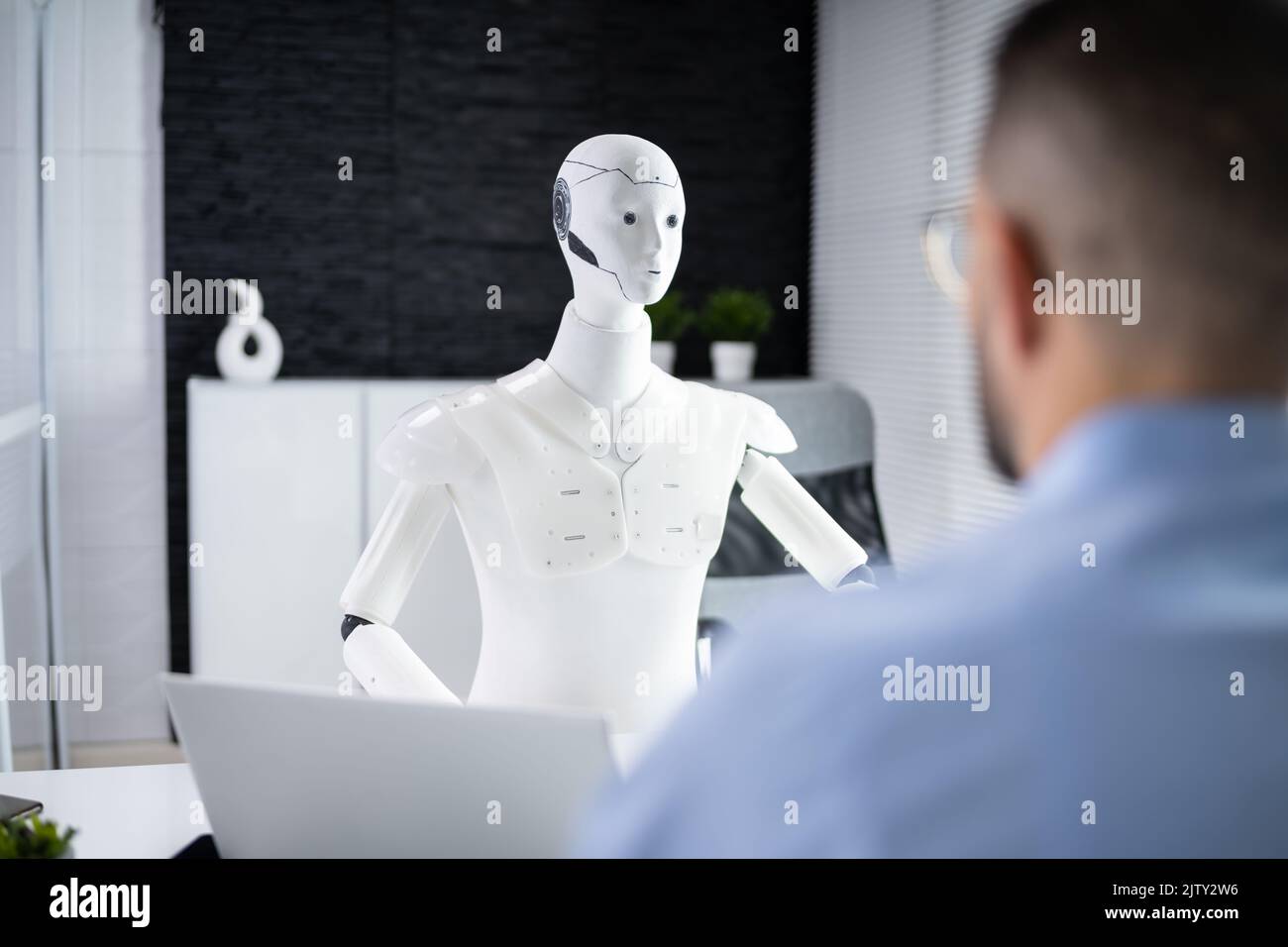 Men At Interview With AI Robot Machine Stock Photo - Alamy