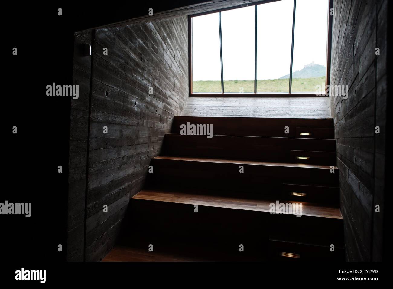 Large panoramic windows with stairs at cube room Stock Photo - Alamy
